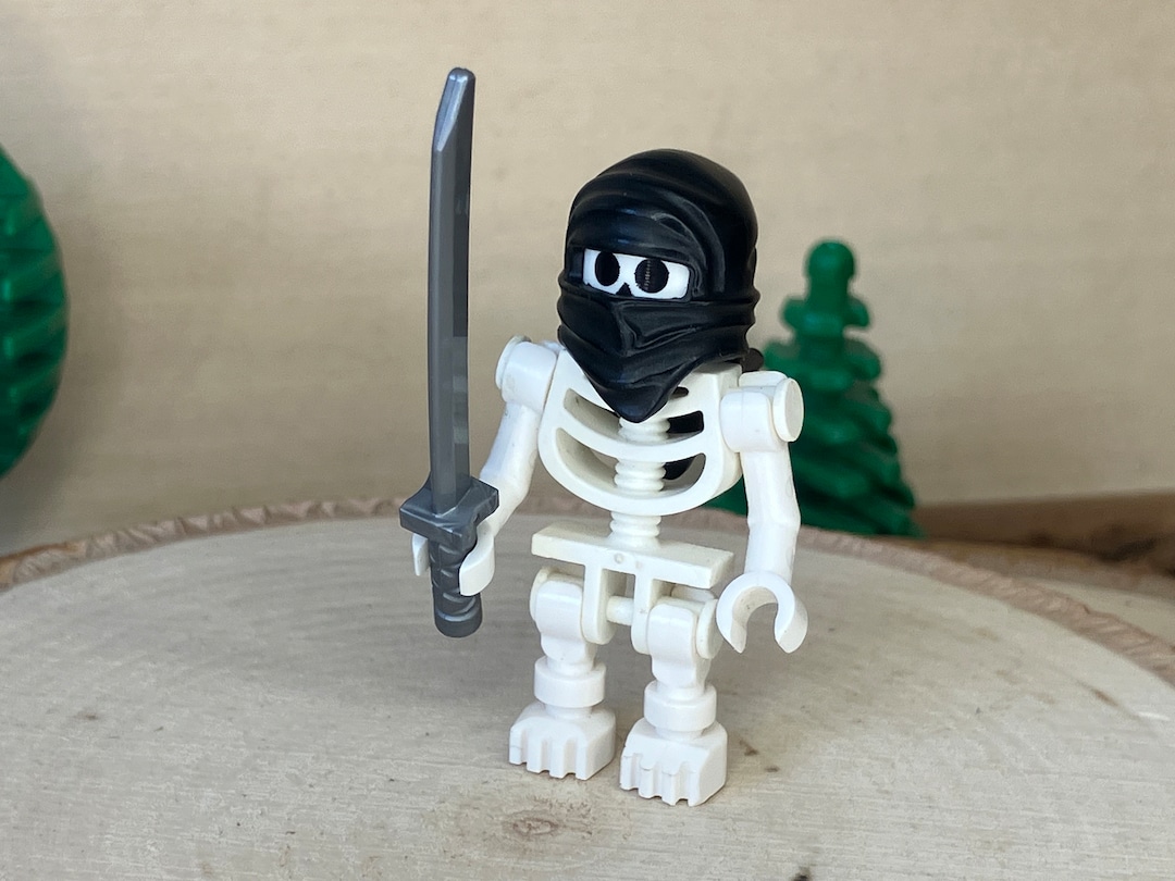 Skeleton Ninja Wearing a Black Ninja Wrap Holding a Katana Sword ...