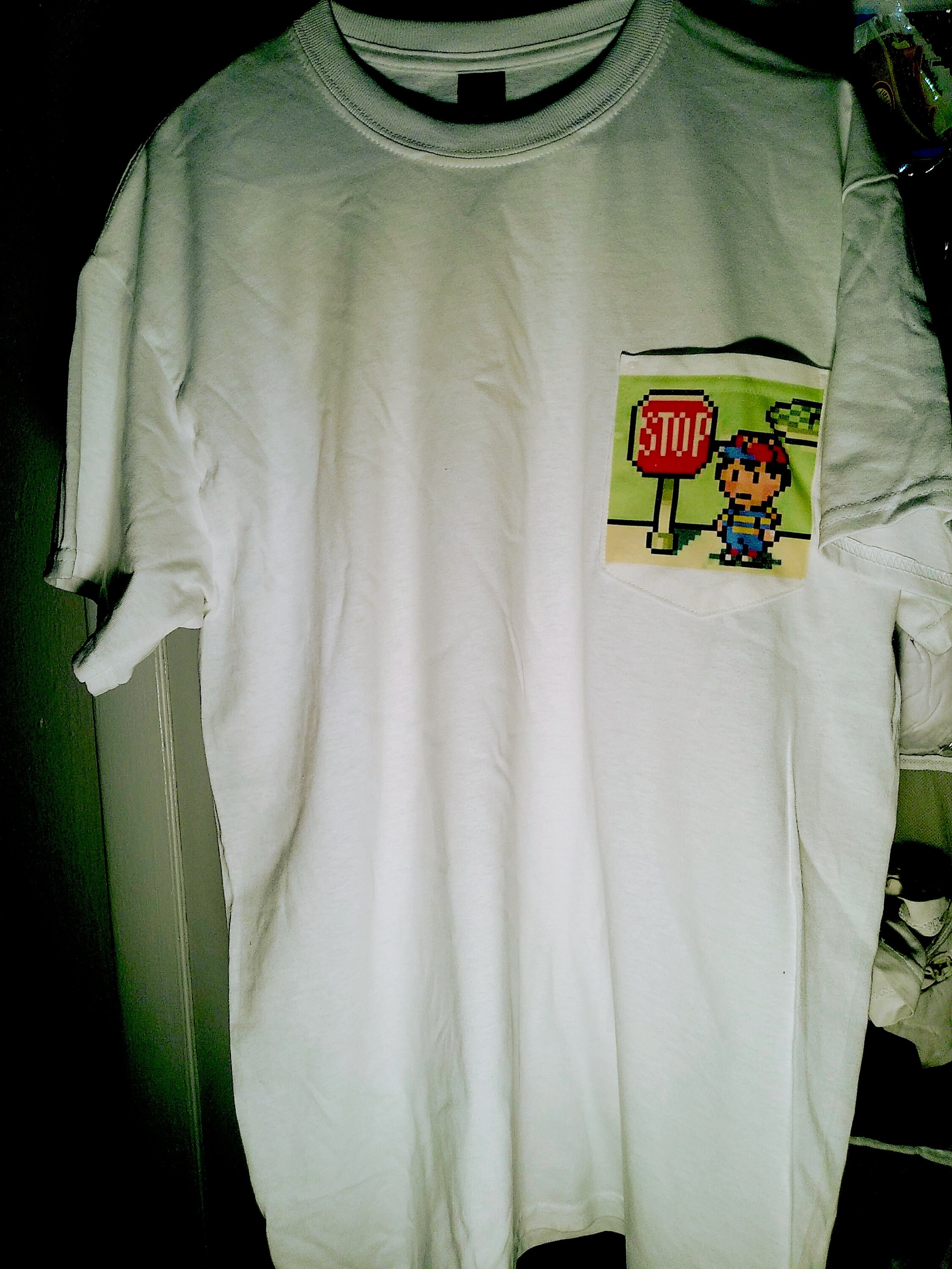 Ness Waiting for the Bus at a Stop Sign Pocket Tee | Etsy