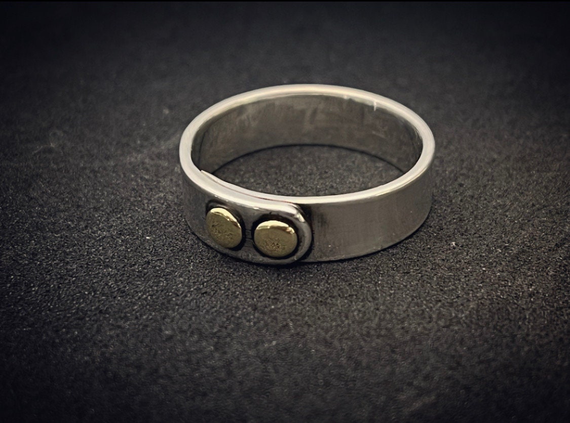 Sterling silver ring with Brass rivets; old school clamp style