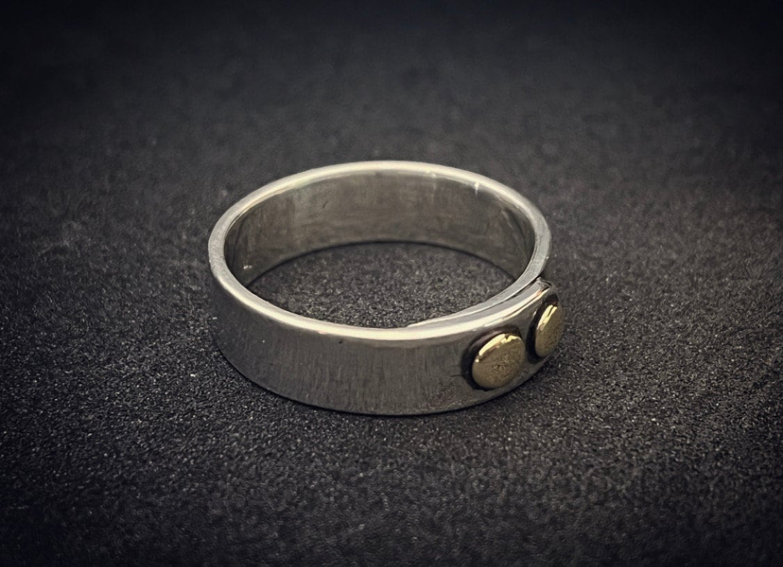 Sterling silver ring with Brass rivets; old school clamp style