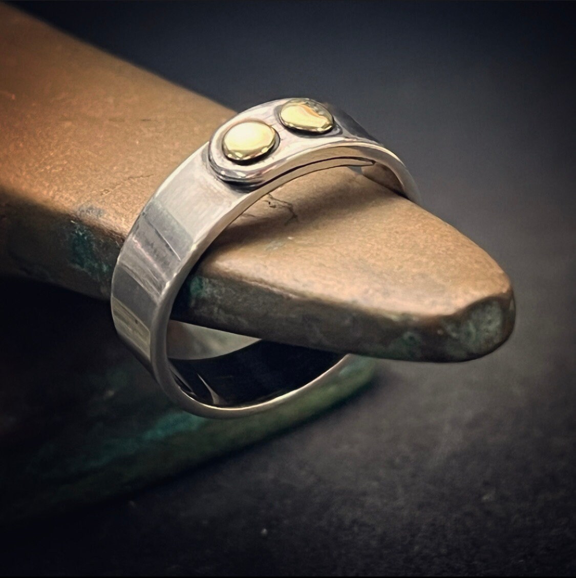 Sterling silver ring with Brass rivets; old school clamp style