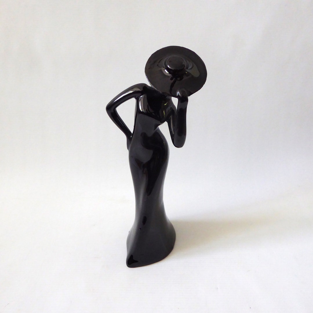 1980s Stylised Pottery Woman in Hat. Vintage Retro Glossy Black ...