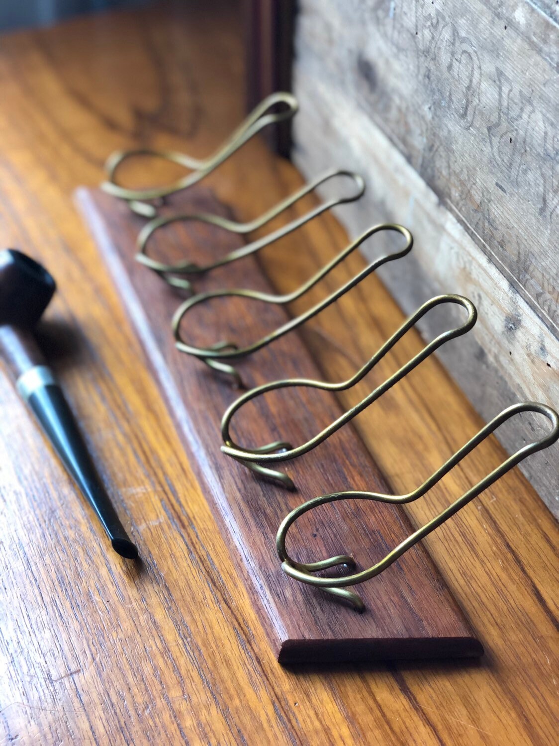 Scandinavian teak and bronze pipe holder mid century modern 1960s