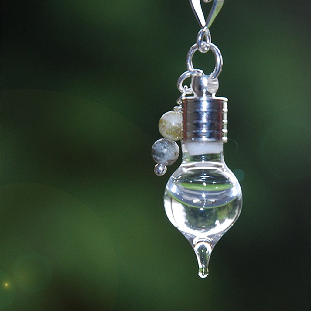 Glass teardrop pendant holding water from the holy wells of | Etsy