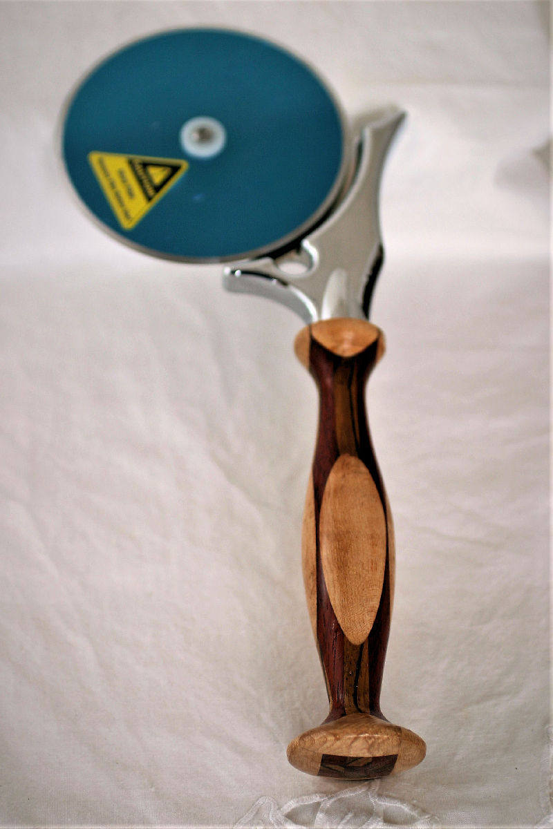 This Hand Crafted Segmented Wooden Pizza Cutter is Made of Birds-eye ...