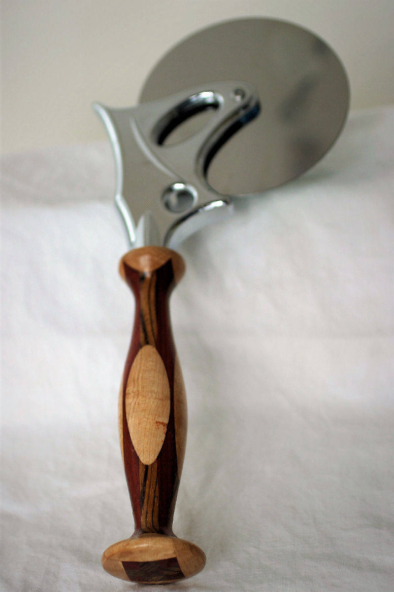 This Hand Crafted Segmented Wooden Pizza Cutter is Made of Birds-eye ...