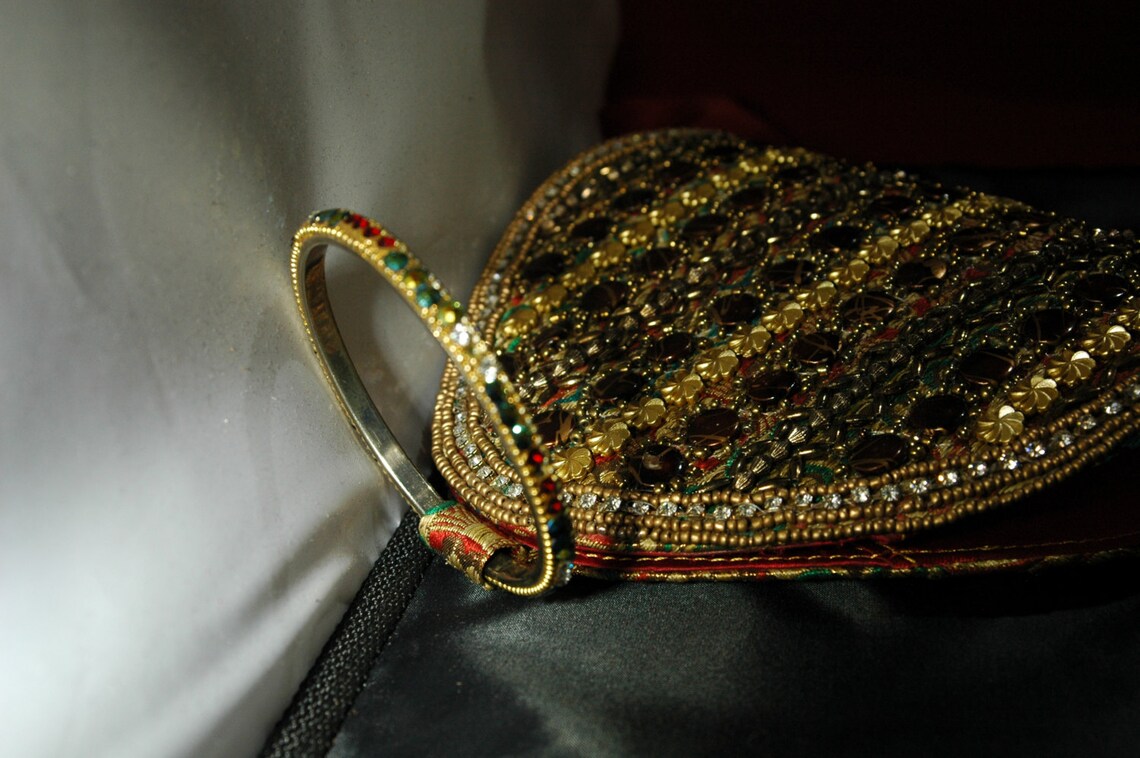 A Small Hard Side Purse With 1 Side Decorated Round Jeweled Handle 6 by ...