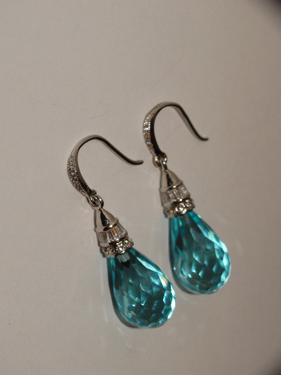 White Tone Blue Faceted Blue Topaz Glass Stone Dangling Costume ...