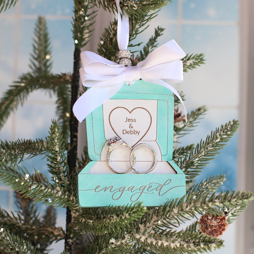 First Christmas Engaged Ornament, Stackable Wedding Rings in A Wooden ...