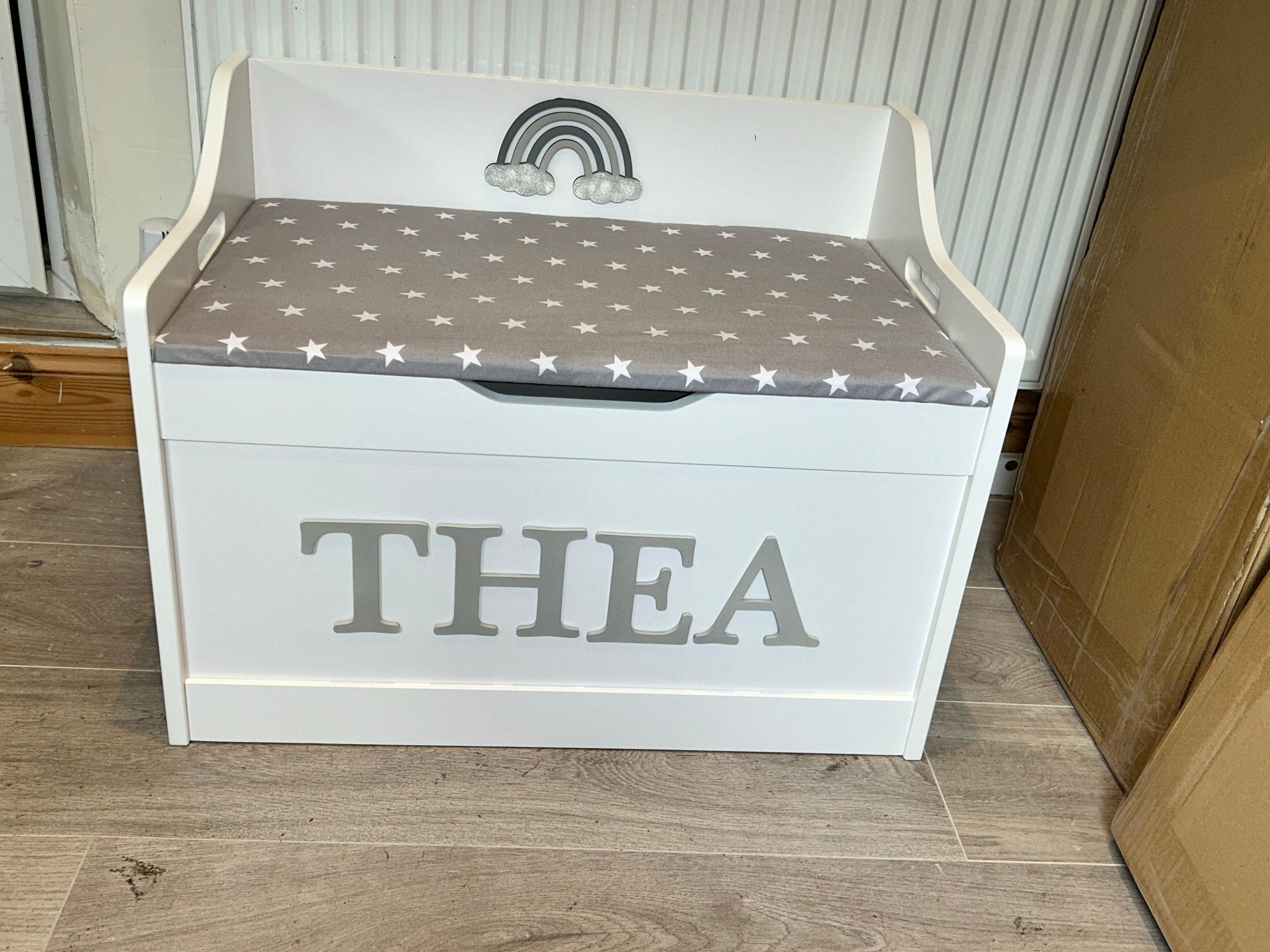 Wooden personalised toy box with grey star cushion seat soft close hinge personalised toy box name