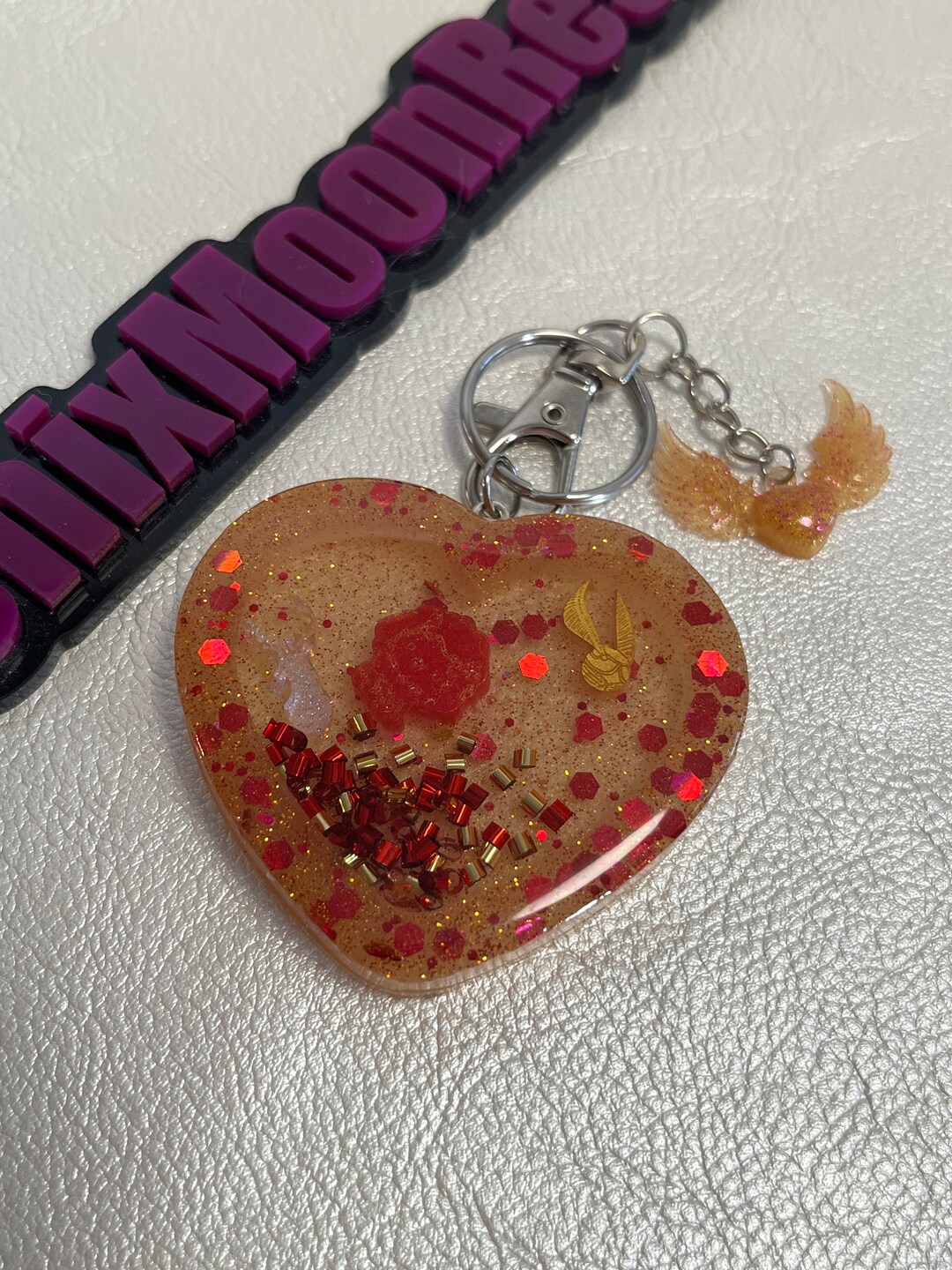 Red and Gold Liquid Shaker Heart Resin Keychain With H.P. Brave House ...
