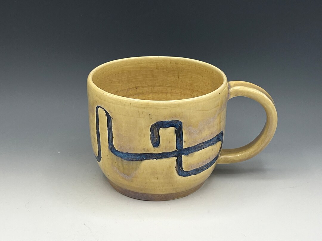 Wheel-thrown Mug With the Carved Abstract Design With a Warm Cream ...