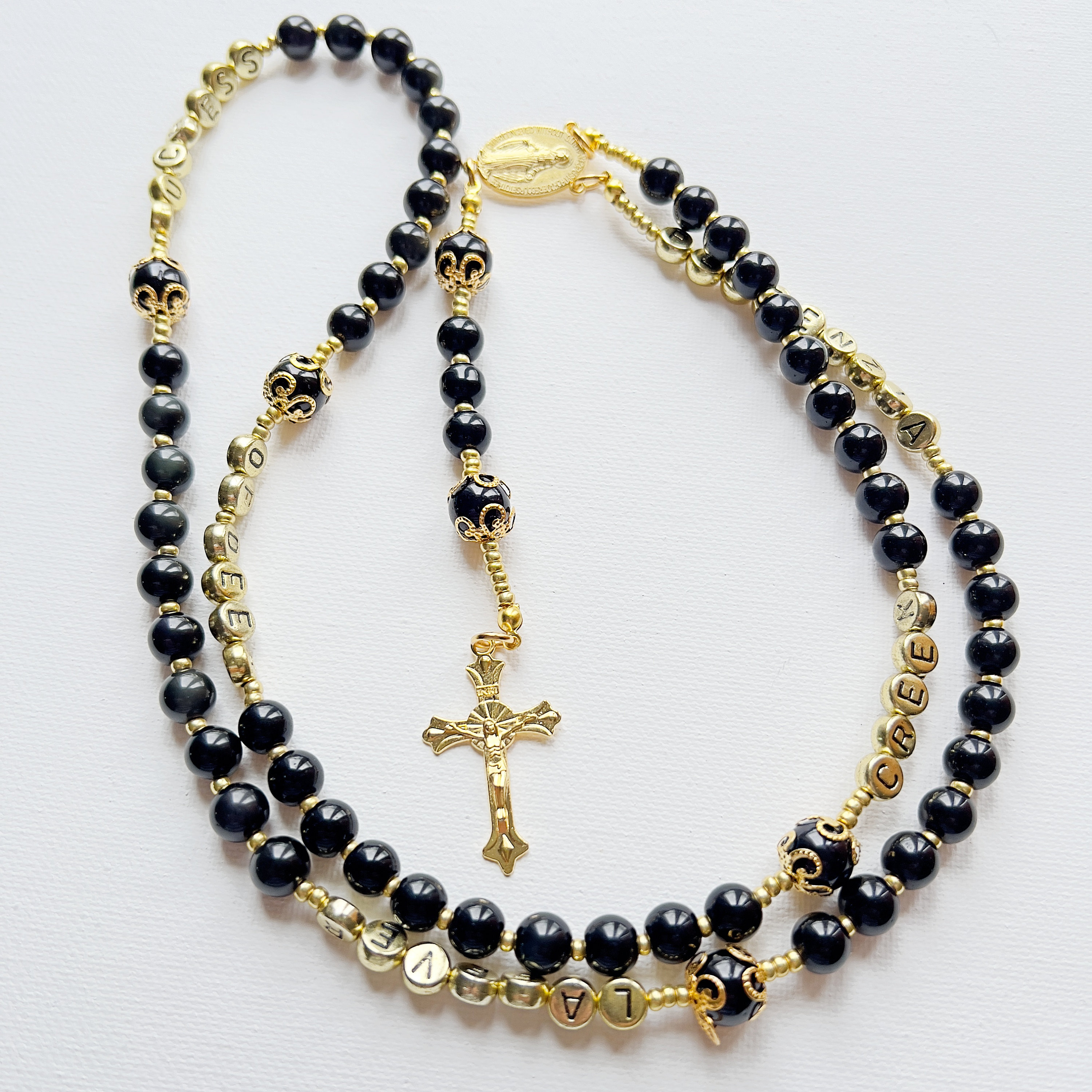 Black and gold rosary store