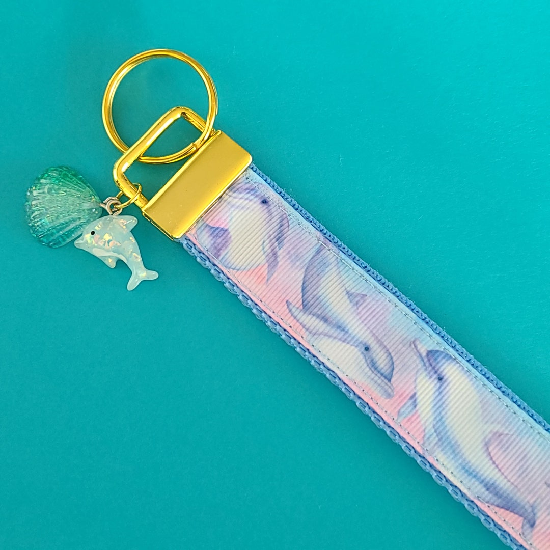 Dolphins in Watercolor Pink Blue Waters on Yellow Gold Key Fob Wristlet ...
