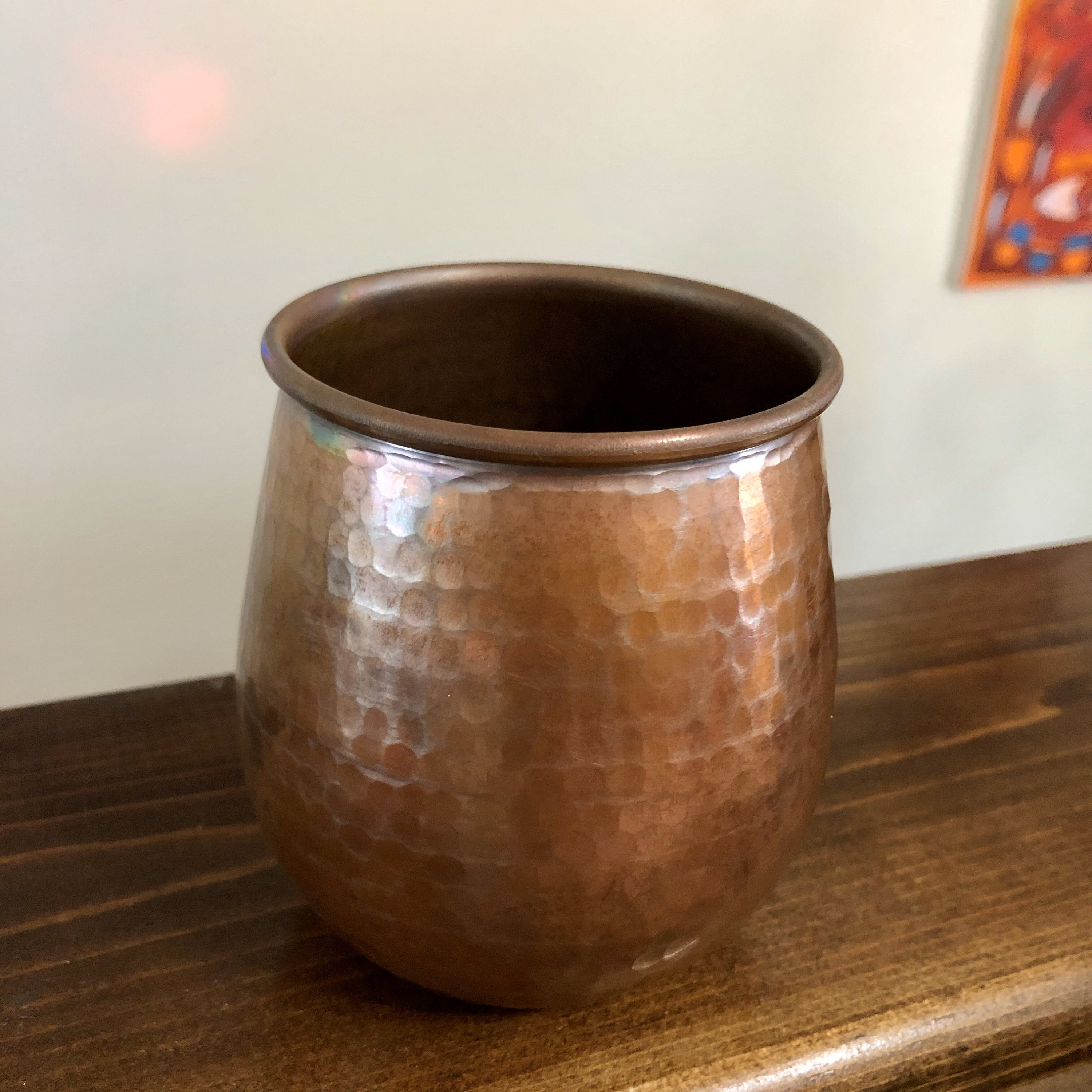 Hammered copper stemless wine glass with brown patina finish