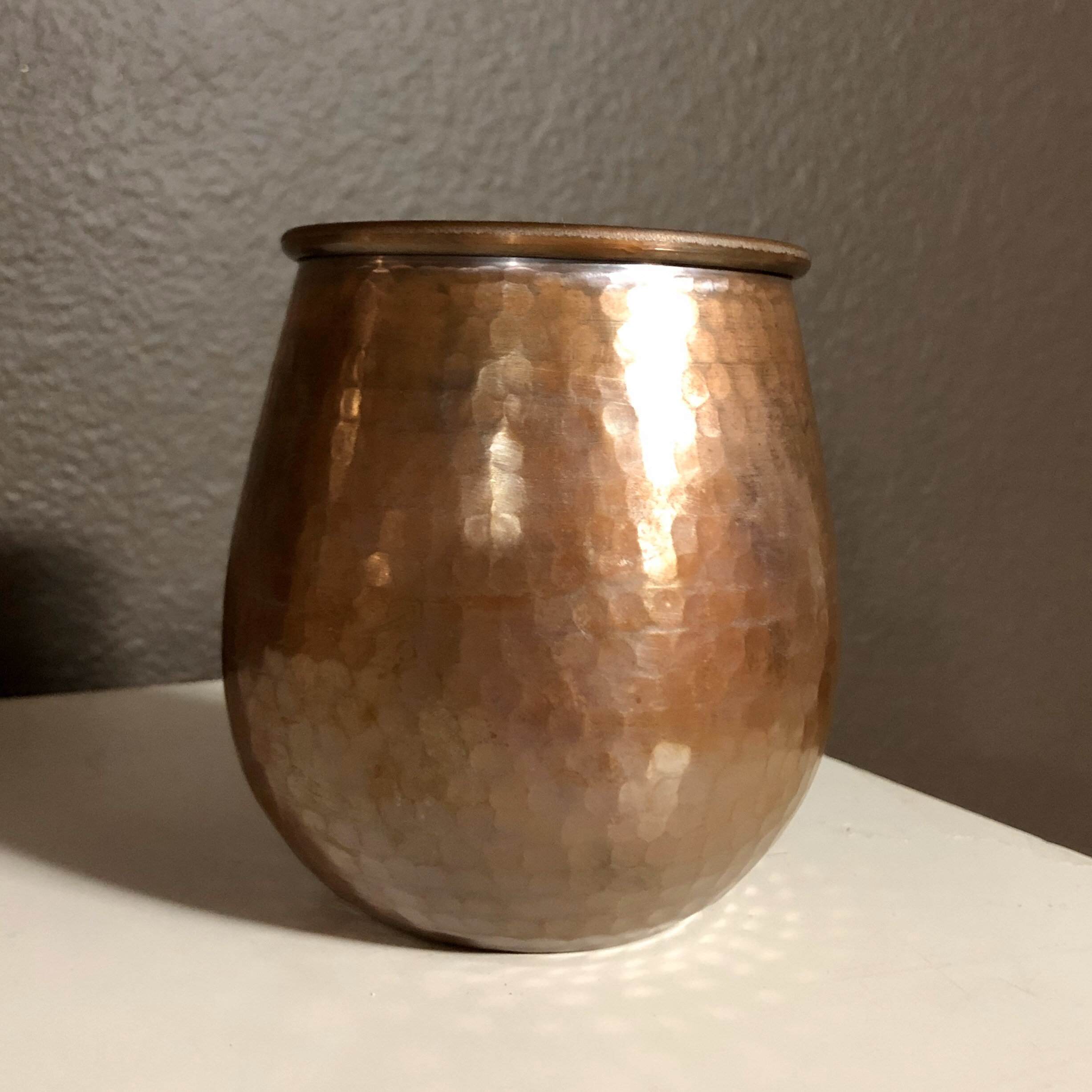 Hammered copper stemless wine glass with brown patina finish