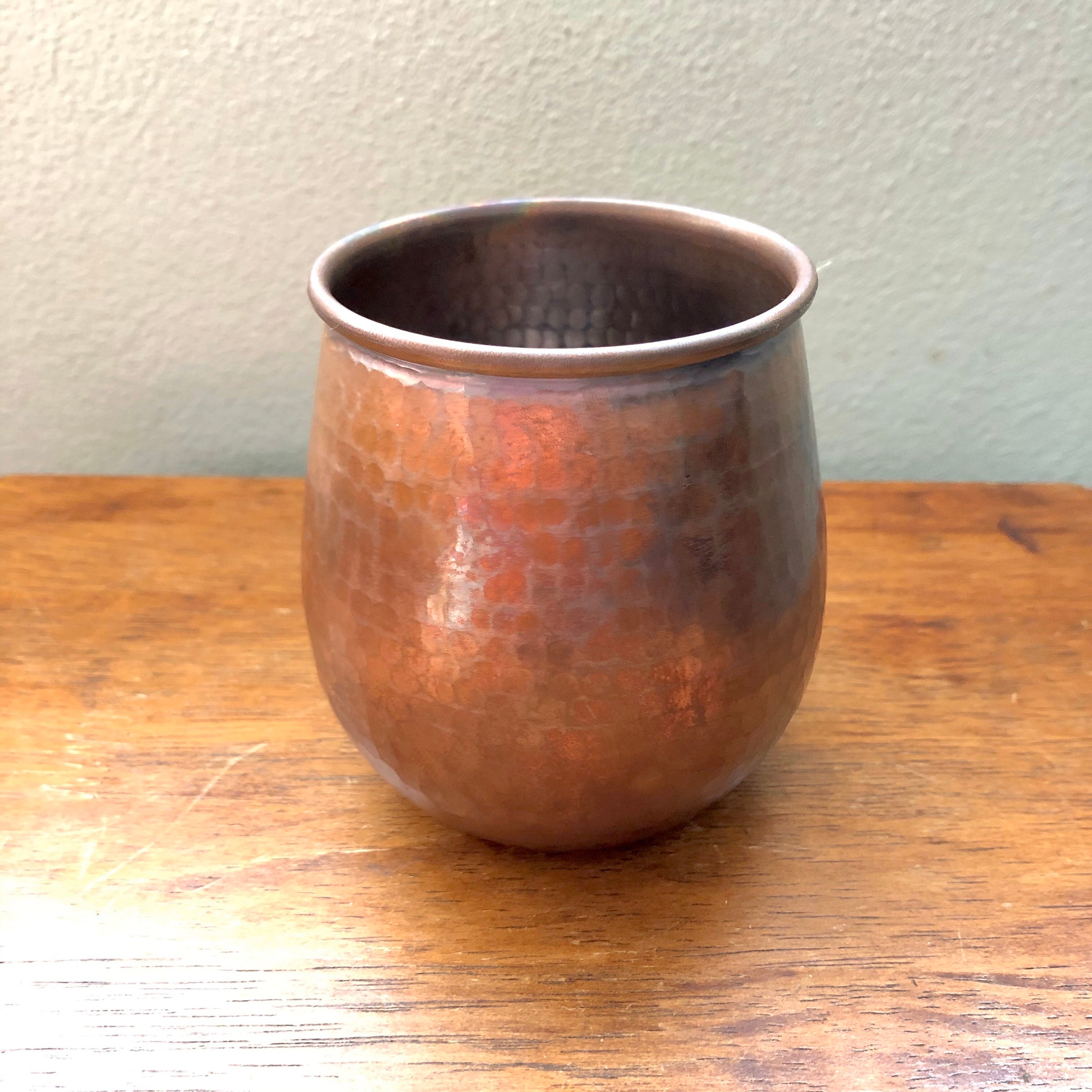 Hammered copper stemless wine glass with brown patina finish
