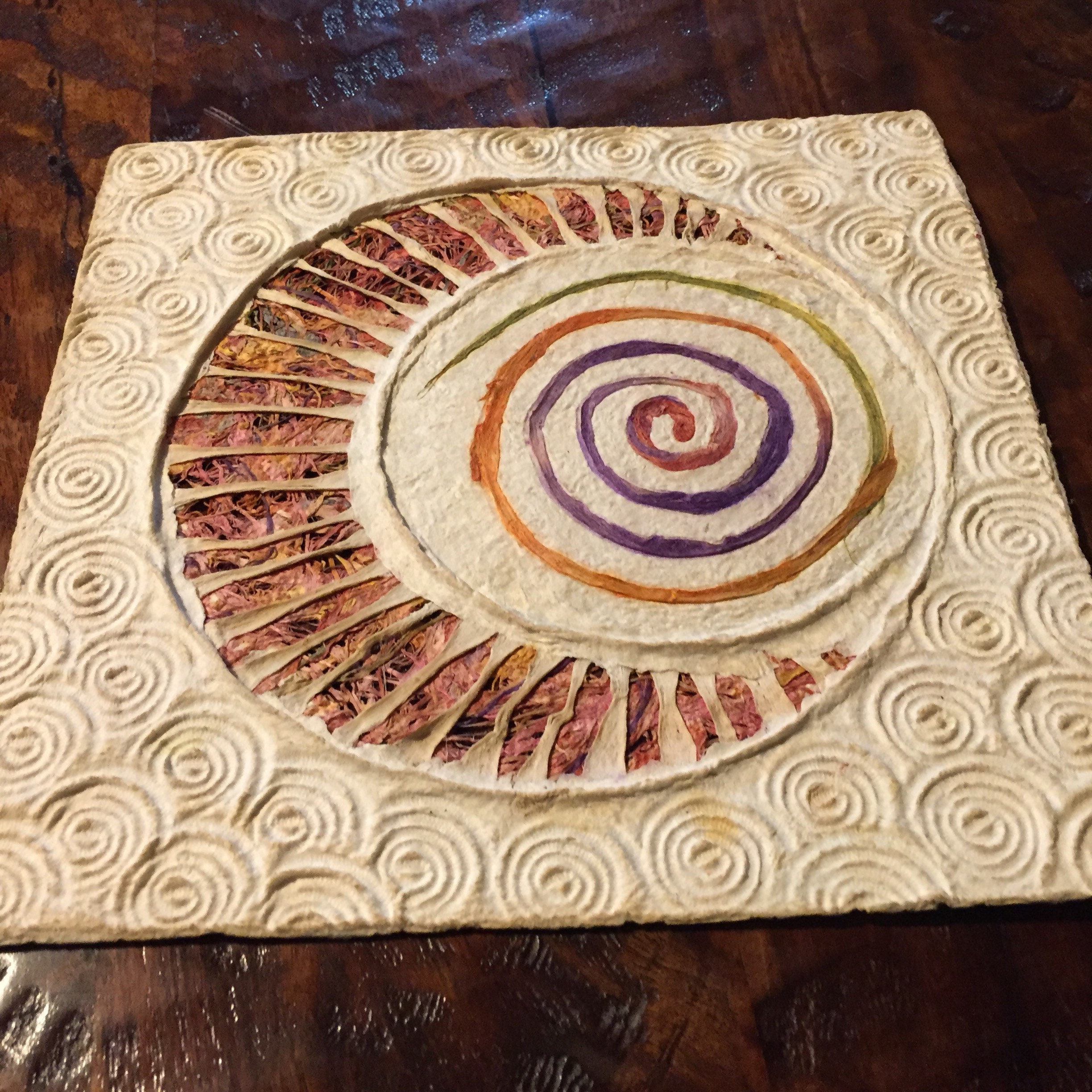 Handmade Amate Paper Wall Art with multicolor woven moon and spiral