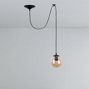 Swag Pendant Light Globe Swag Mount Pendant Lighting Sphere off Center ...