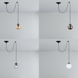 Swag Pendant Light Globe Swag Mount Pendant Lighting Sphere off Center ...
