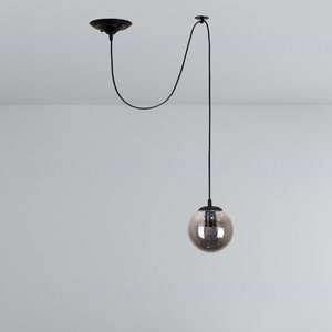 Swag Pendant Light Globe Swag Mount Pendant Lighting Sphere off Center ...