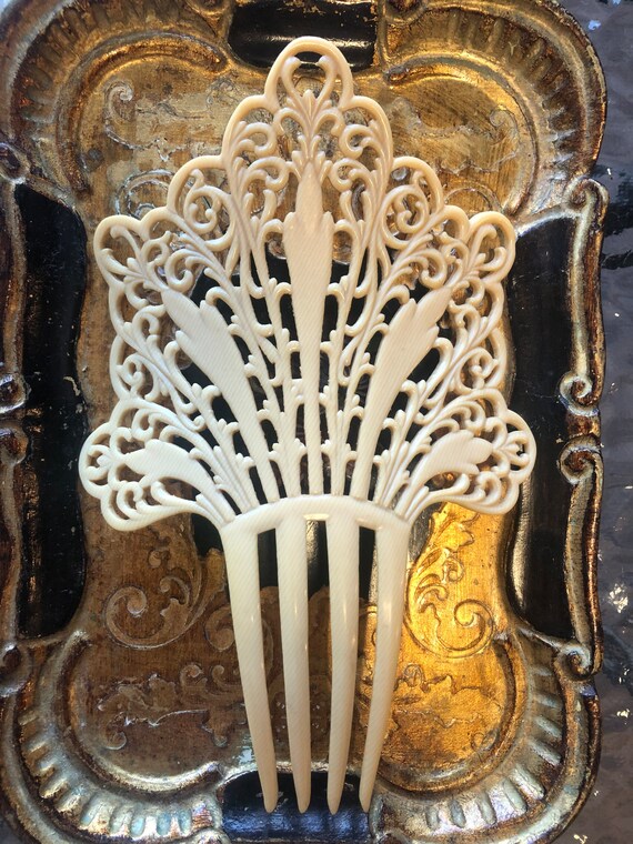 Carved "french ivory" celluloid - Gem