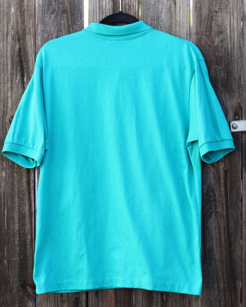 Extremadamente raro 1970's Matty The Mattel Toys Mascot Mens Teal Polo ...