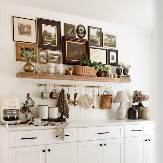 White kitchen with floating shelves store