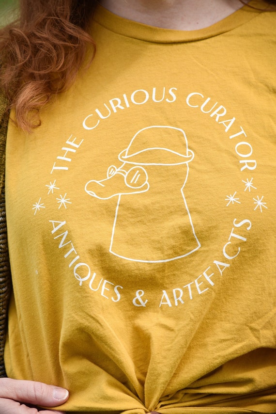 The Curious Curator Tee Magical Antiques and Artefacts | Etsy