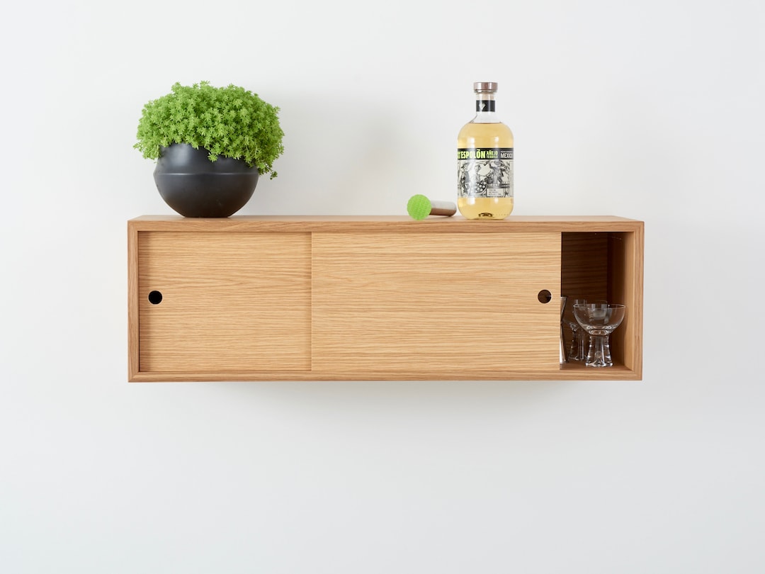 Floating cabinet with glass doors store