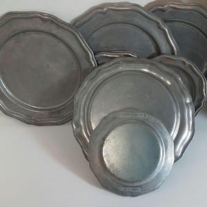 8 Piece Crown-castle Limited Pewter Dishware. 4 Dinner Plates. 4 Salad ...