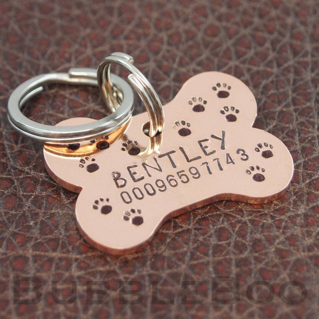 Pet Dog Name Tag. Personalised Bone Shaped Copper Tag With Pawprints ...