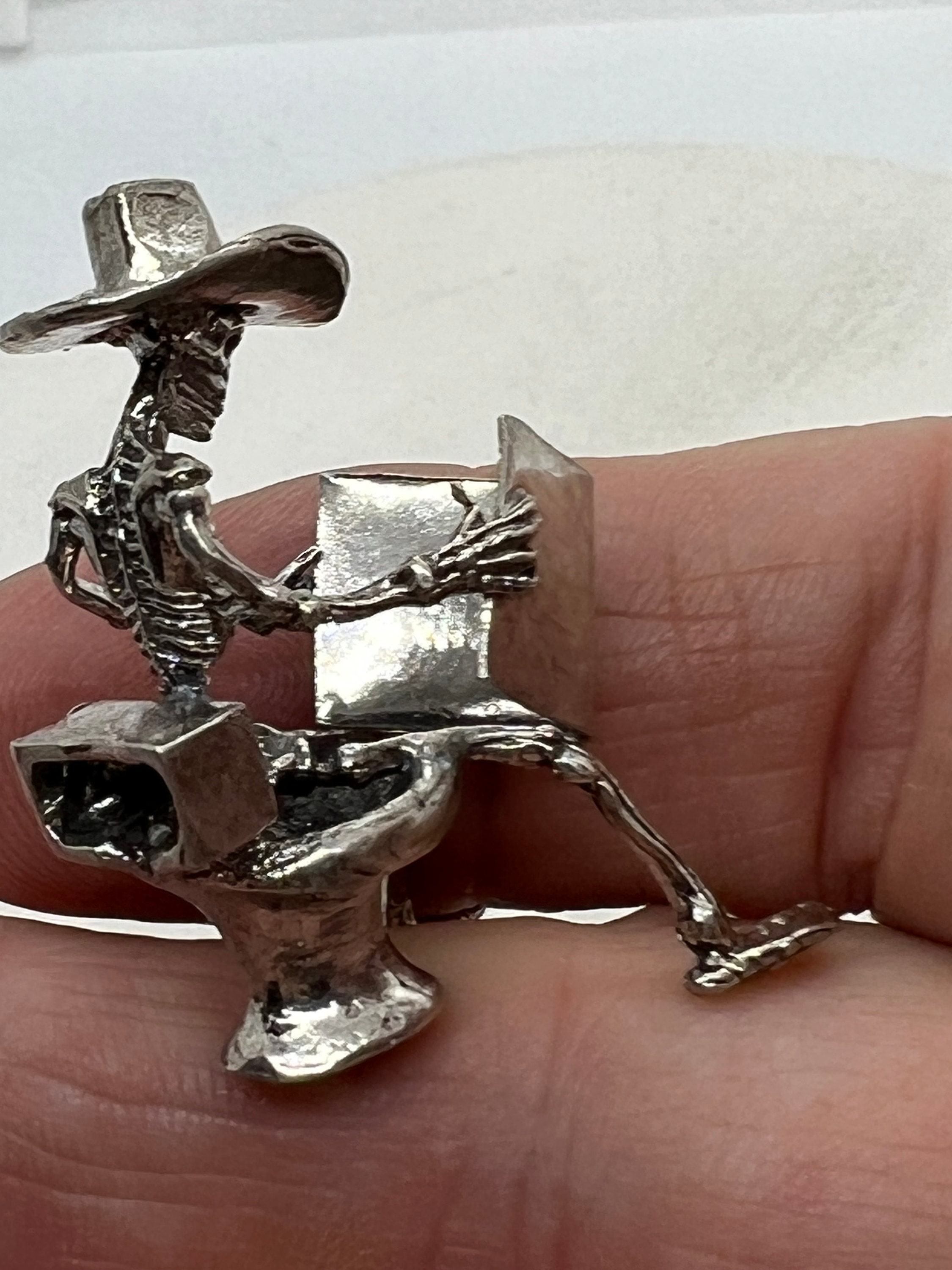 Cowboy on the Thrown Reading the Newspaper, Sterling Silver Bones Alive ...