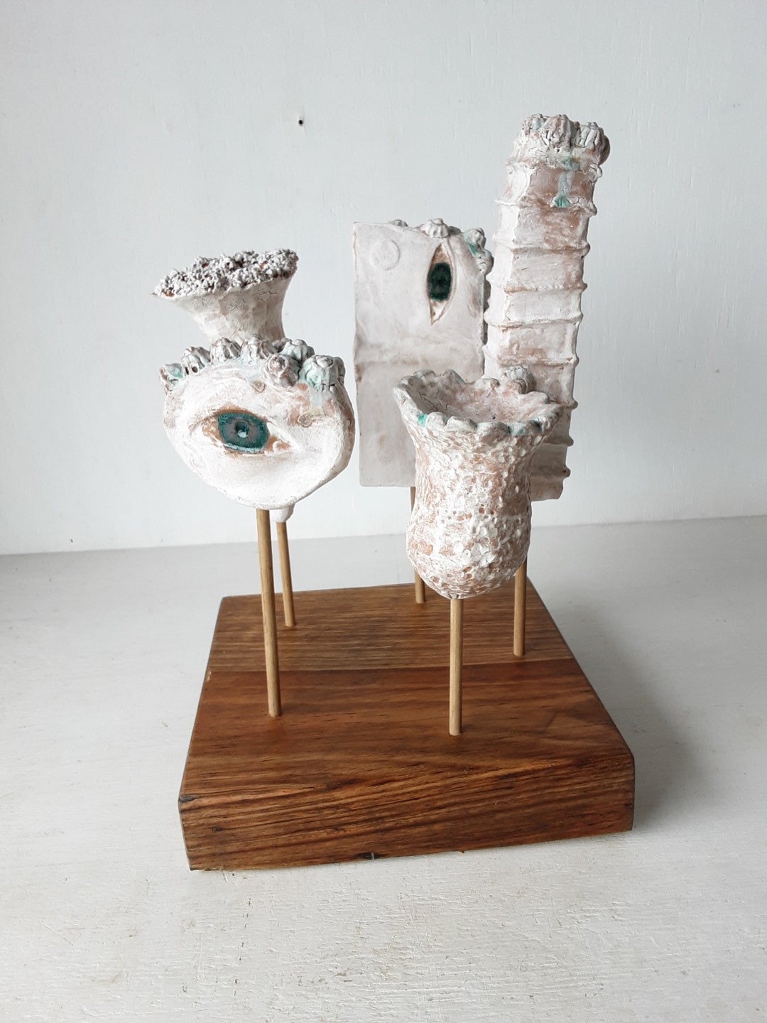 White Sculpture With Five Organic Ceramic Shapes on a Timber Plinth ...