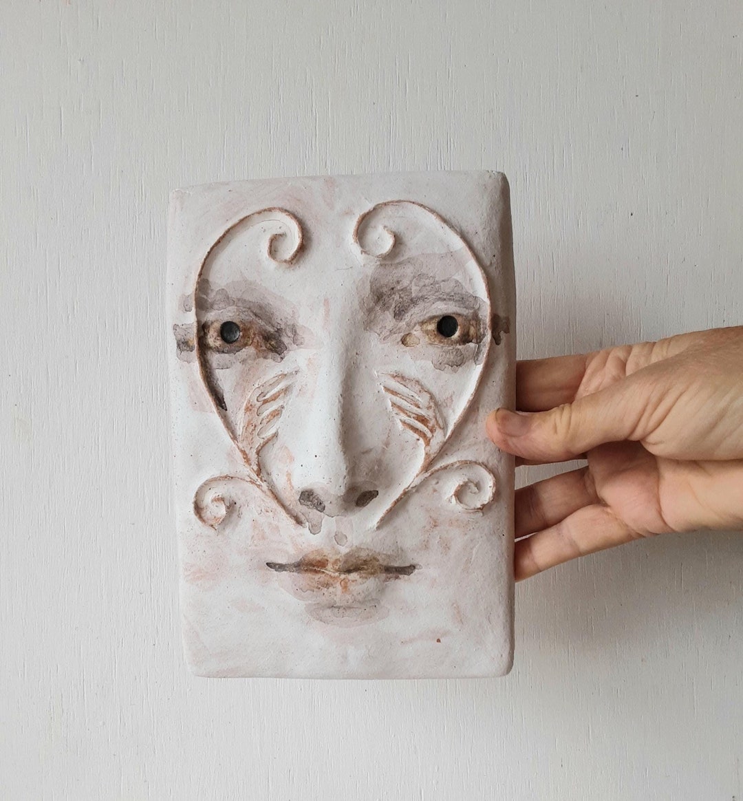 White Ceramic Tile Face Sculpture With Florentine Style Flourishes ...