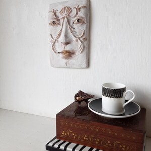 White Ceramic Tile Face Sculpture With Florentine Style Flourishes ...