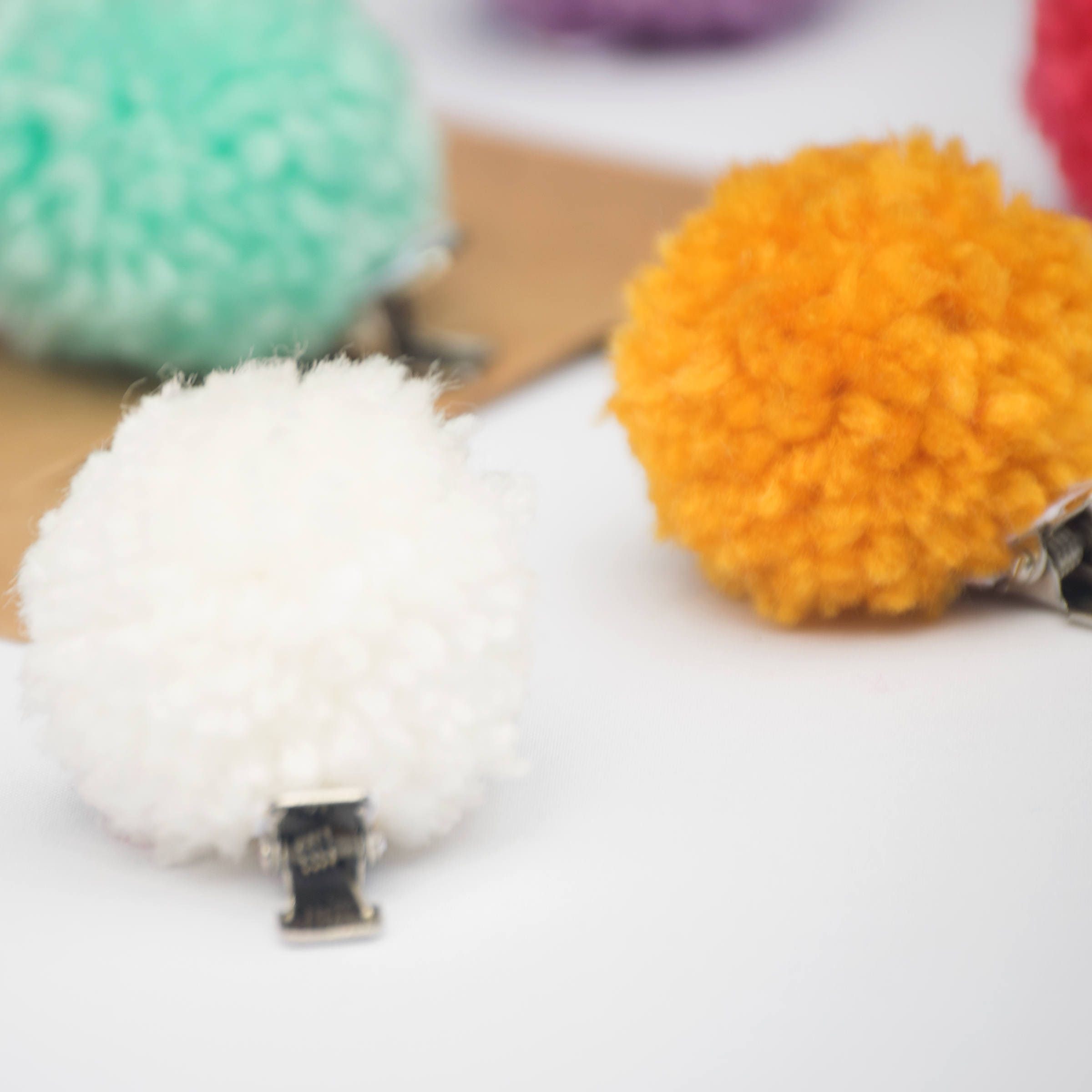 Small Yarn Pom Poms: 2