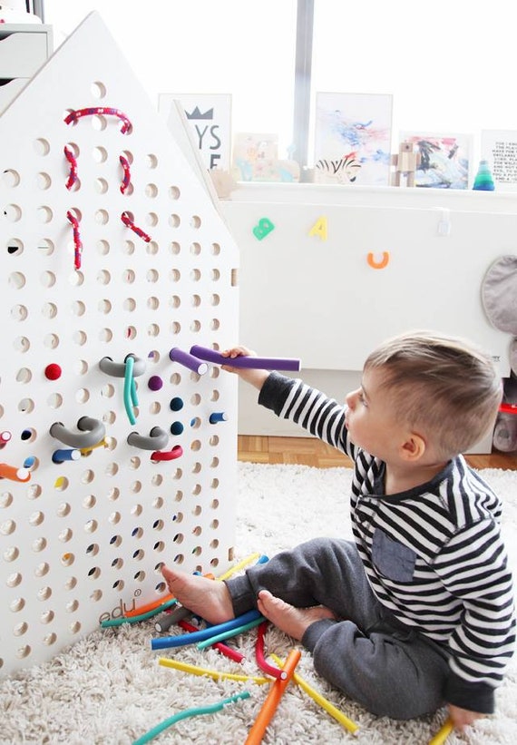 Toddlers Playing With Pegboard