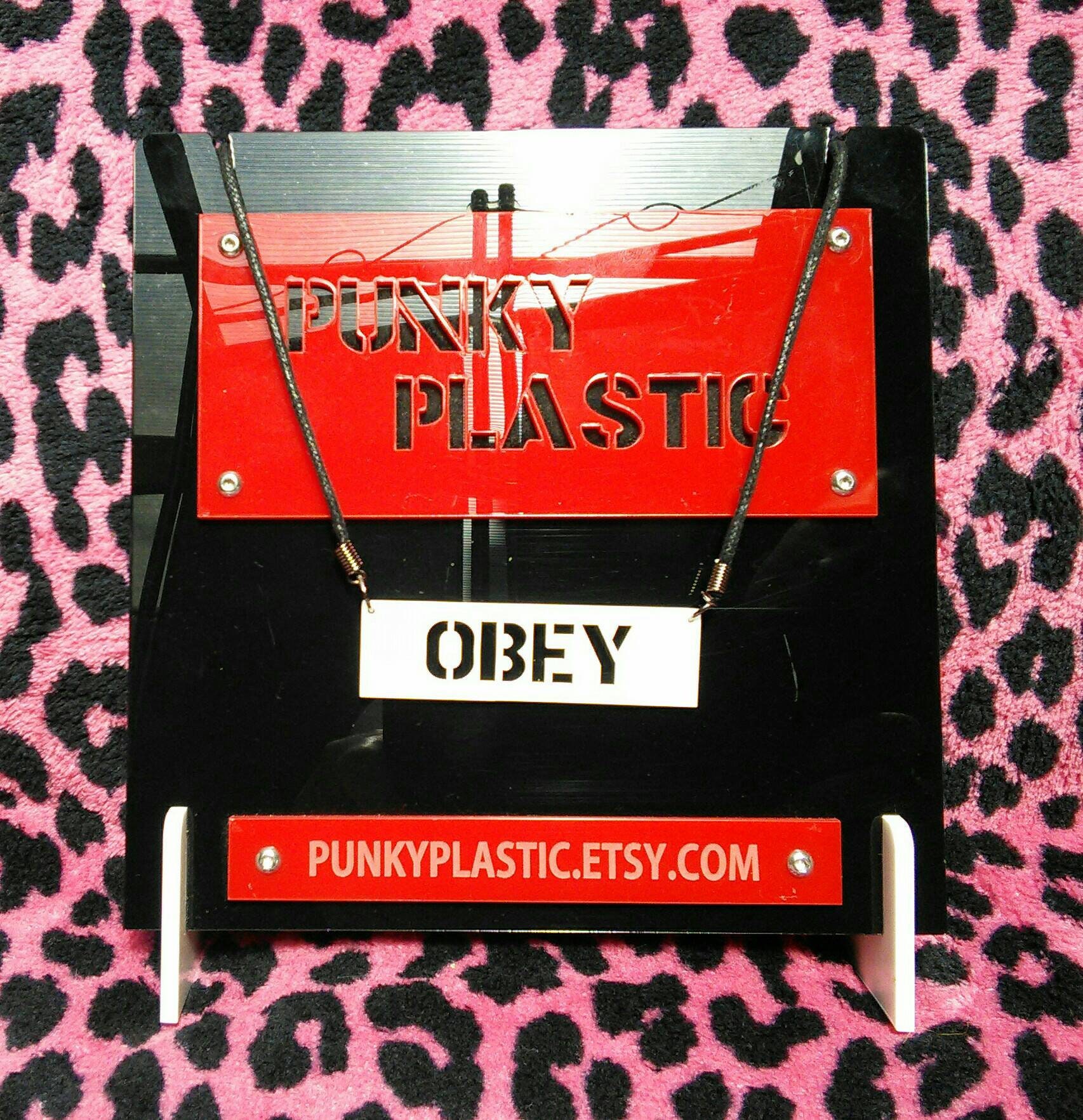 Acrylic OBEY stamp effect cut out letters necklace. | Etsy