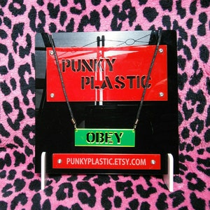 Acrylic OBEY stamp effect cut out letters necklace. | Etsy