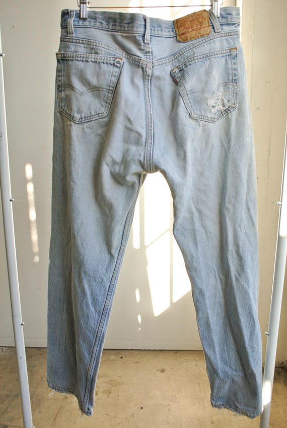 1980s Vintage Custom Patched Levi's 501 Made in USA J… - Gem