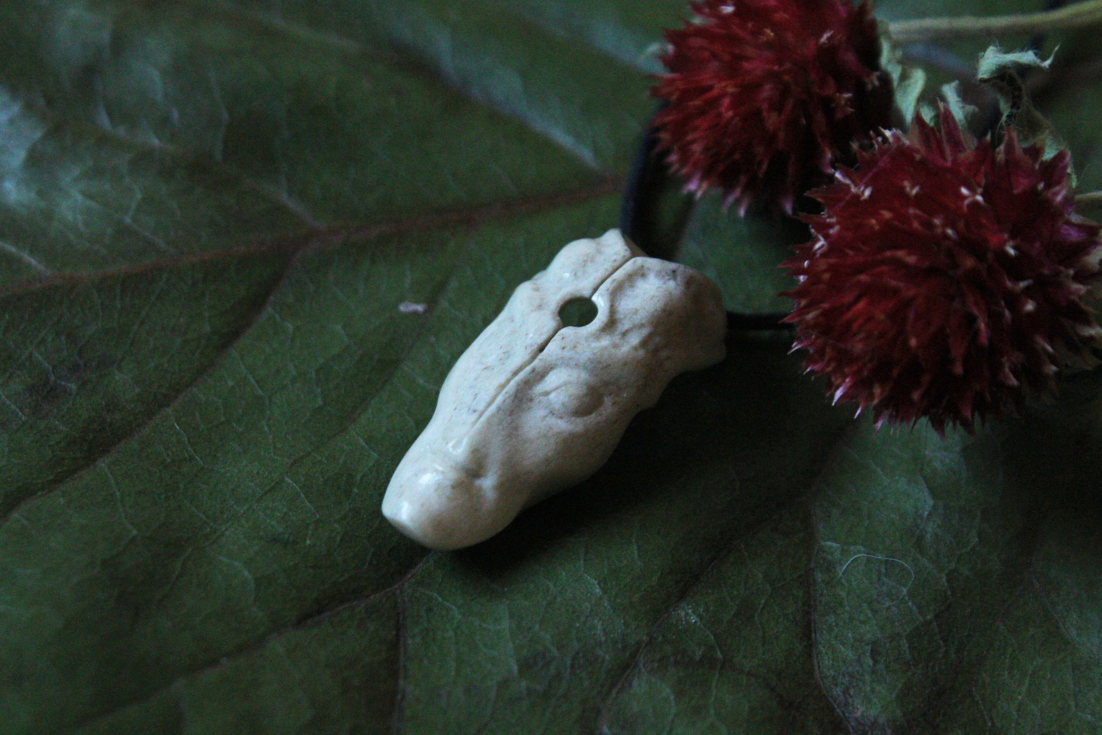 Handcarved antler fantasy alien face pendant | Etsy