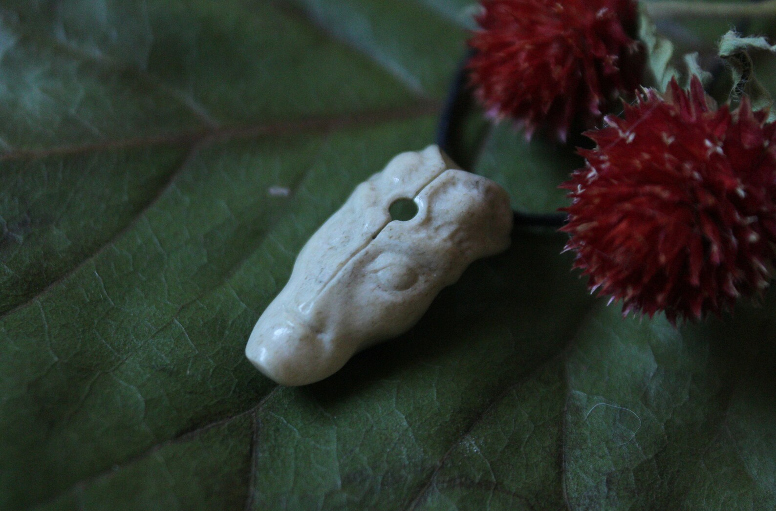 Handcarved antler fantasy alien face pendant | Etsy