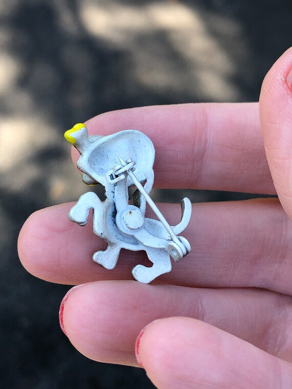 Painted metal dog with bone pin, 1960s - Gem