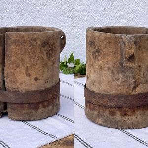 Primitive Wooden Water Buckets Carved Out of Logs and Rusty Metal Cup ...