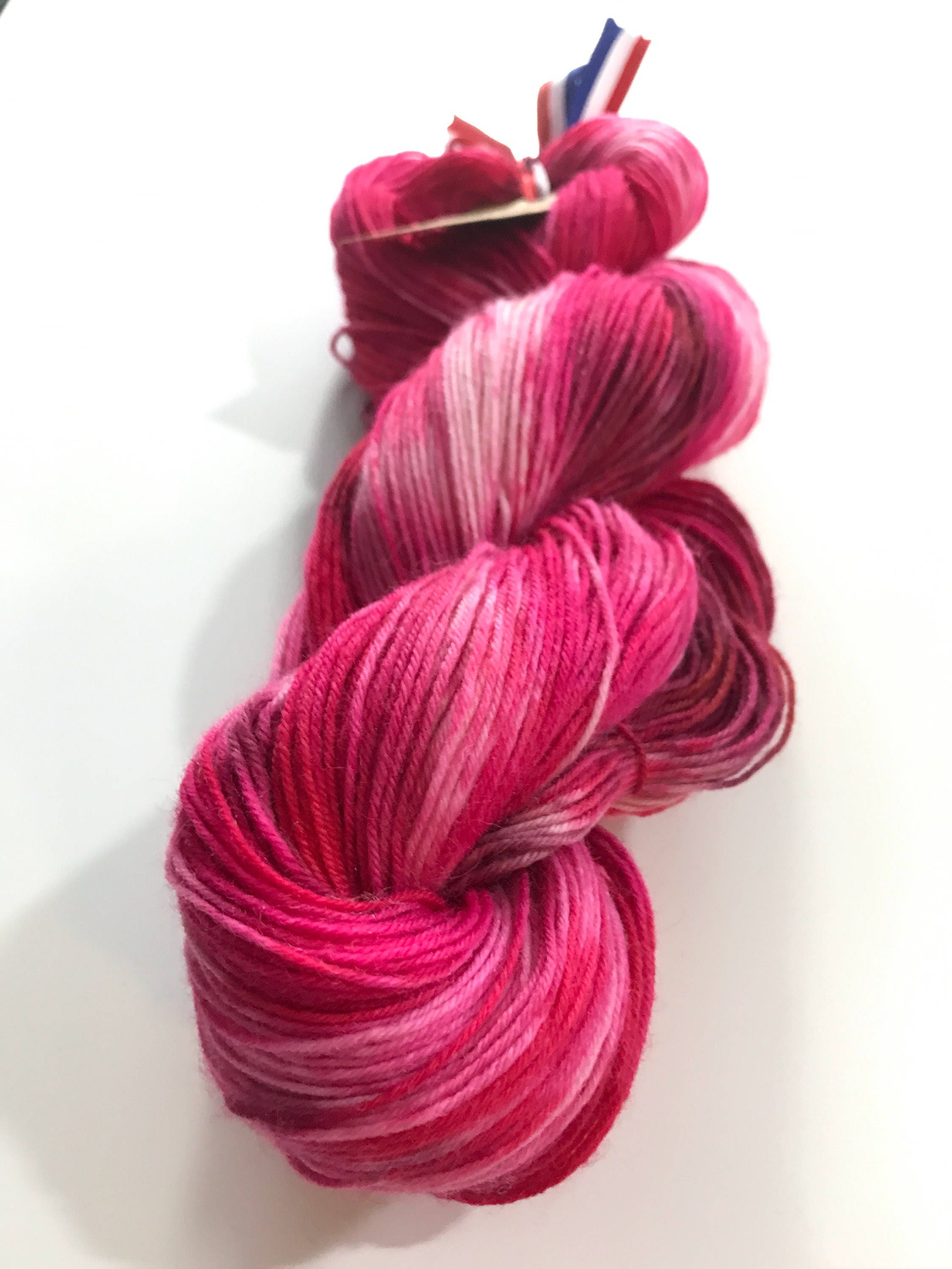 Hand dyed Merino and silk sock yarn in 50 shades of red.