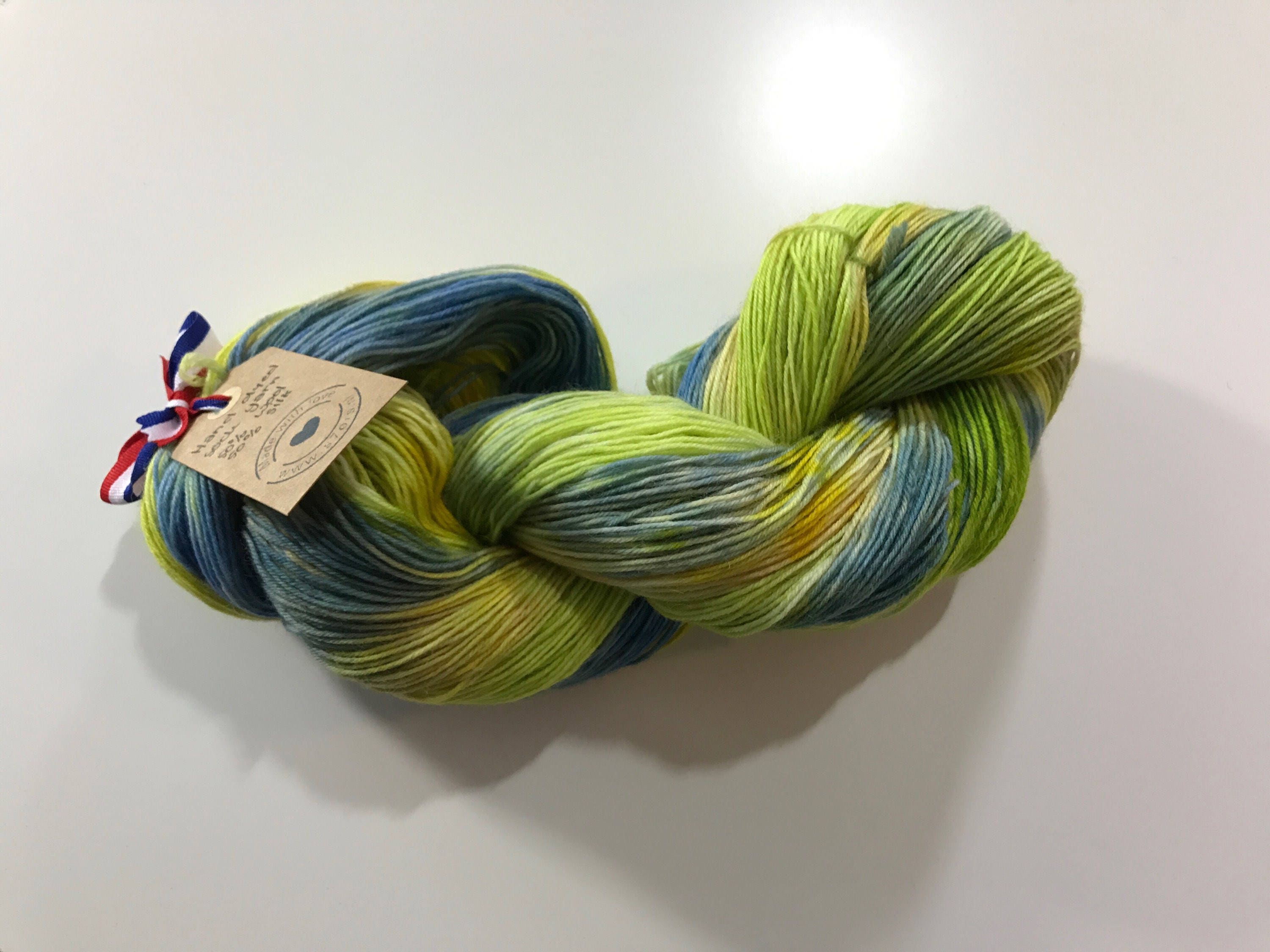 Hand dyed Merino and silk sock yarn in green, yellow and blue.