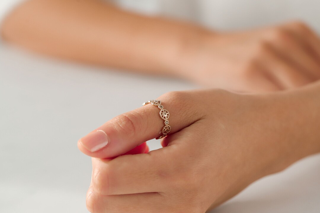 Ring With Small Hoops Joined Together by Light Green Zircons and ...