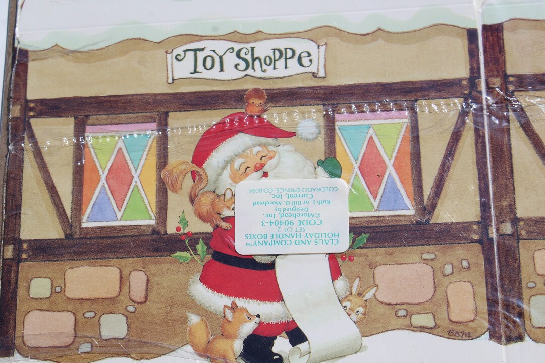 Ruth and Bill Moorehead Christmas Gift Boxes With Santa Claus in Front ...
