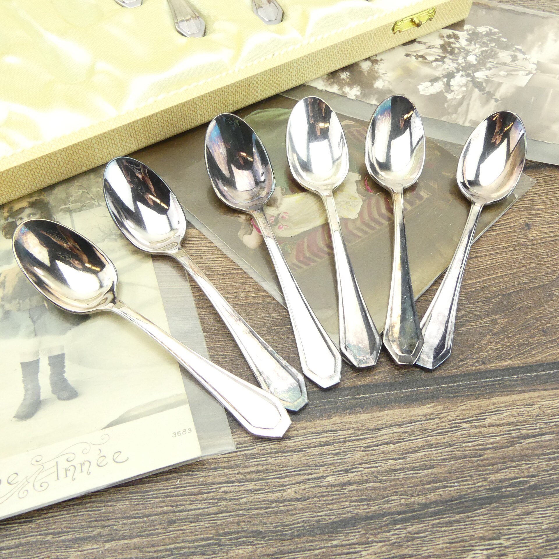 Old silver metal spoons, vintage dessert spoons, box of old spoons
